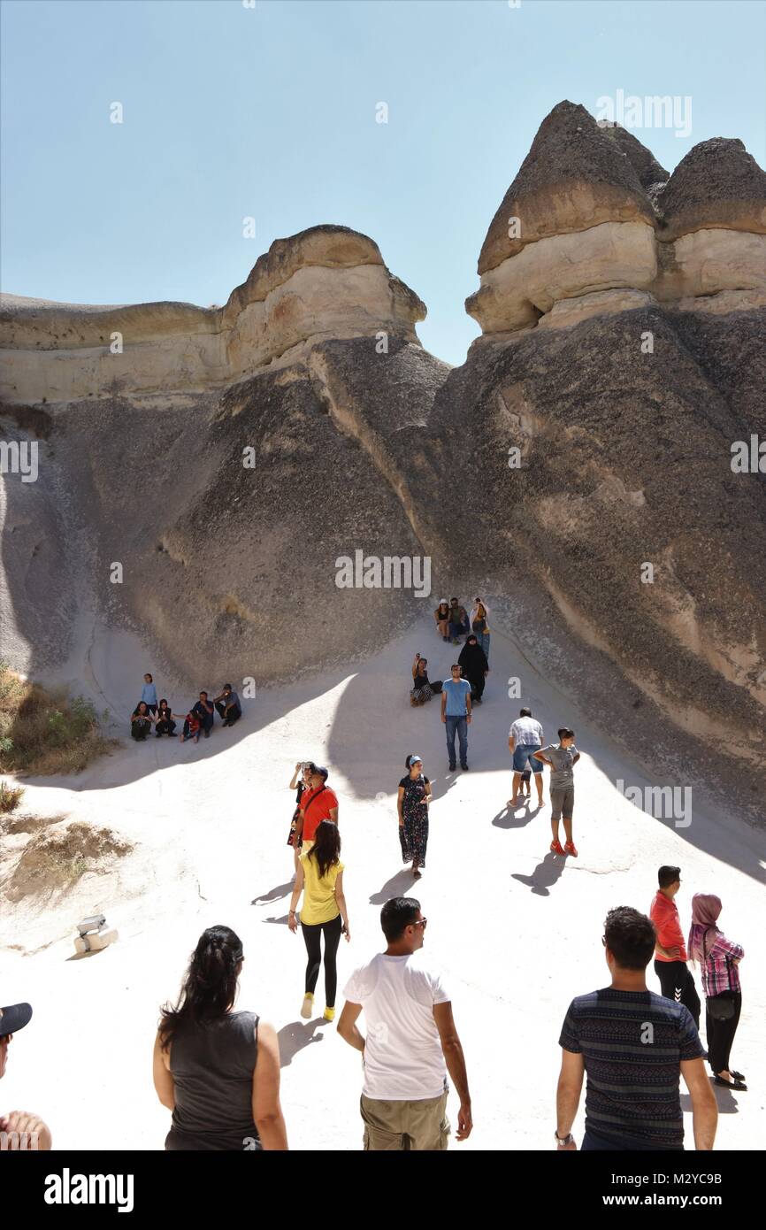 Tourists visiting some of the famous Fairy chimneys in Cappadocia which ...