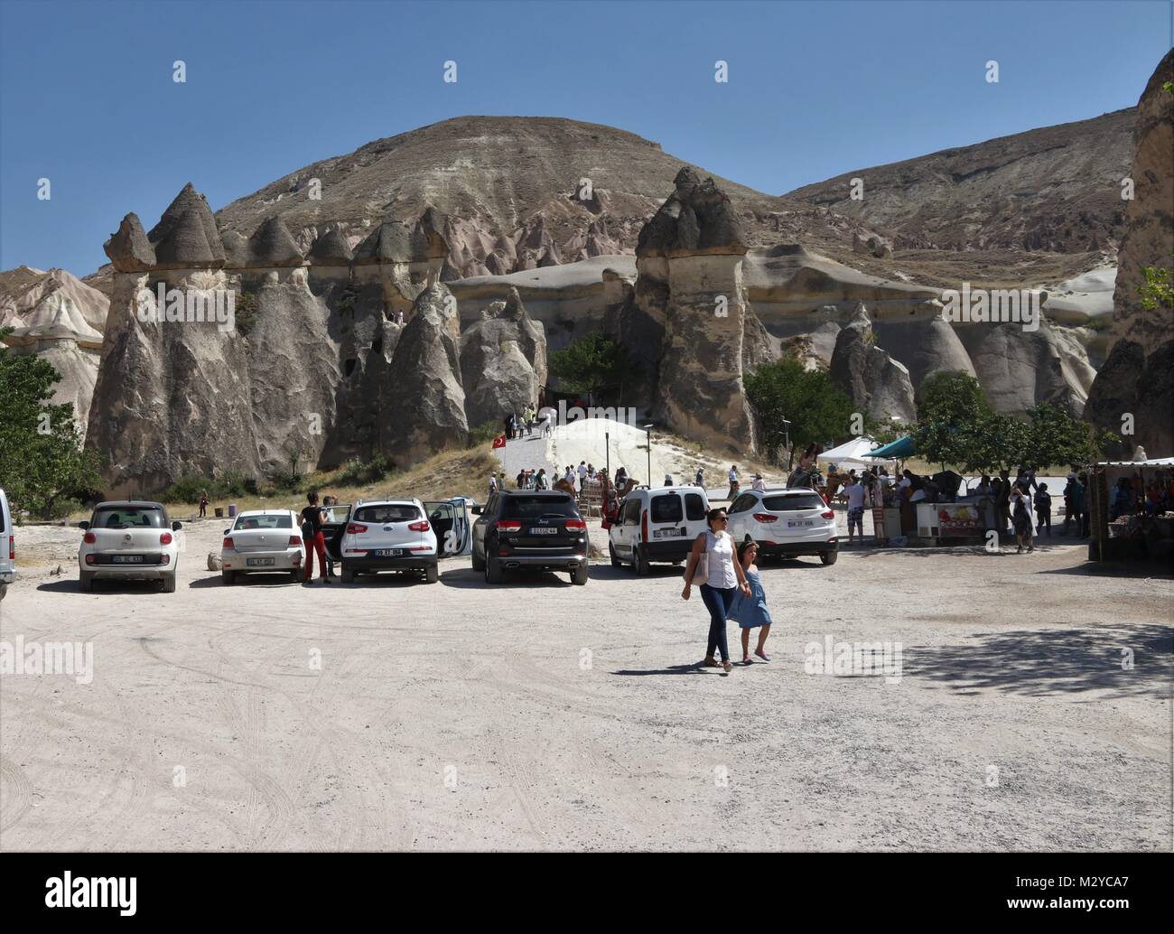 Tourists visiting some of the famous Fairy chimneys in Cappadocia which ...