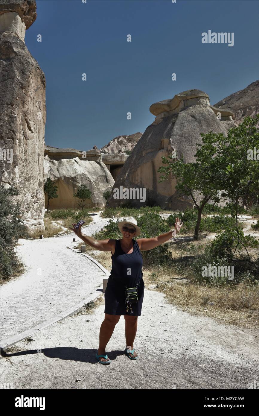 Tourists visiting some of the famous Fairy chimneys in Cappadocia which ...