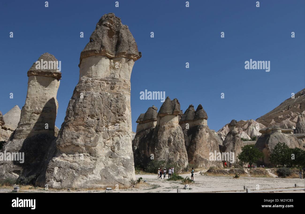 Tourists visiting some of the famous Fairy chimneys in Cappadocia which ...
