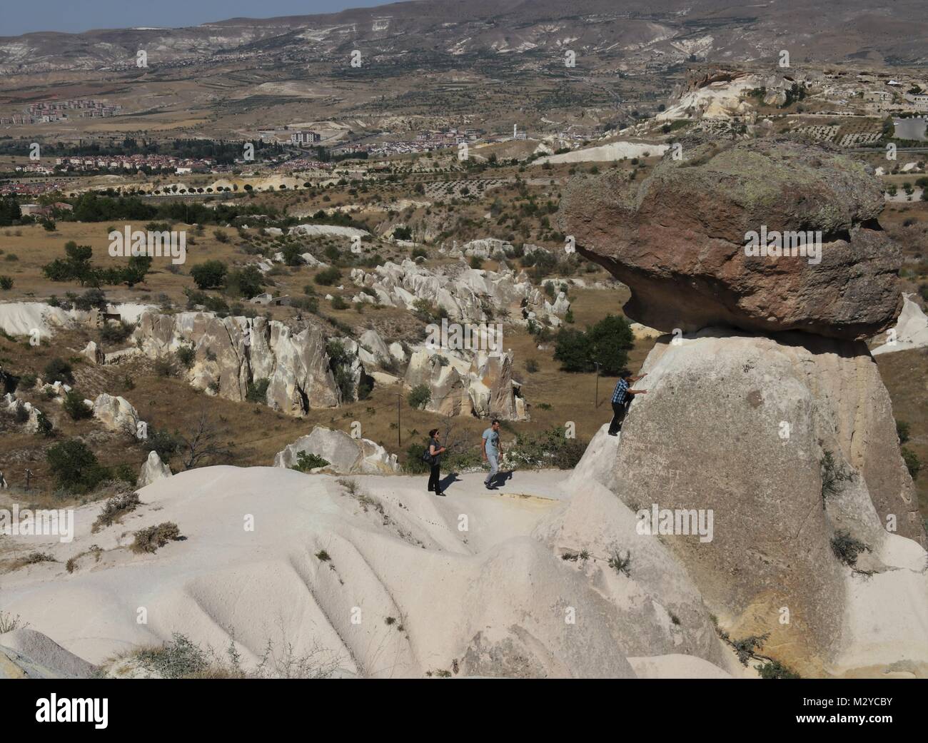 Tourists visiting some of the famous Fairy chimneys in Cappadocia which ...