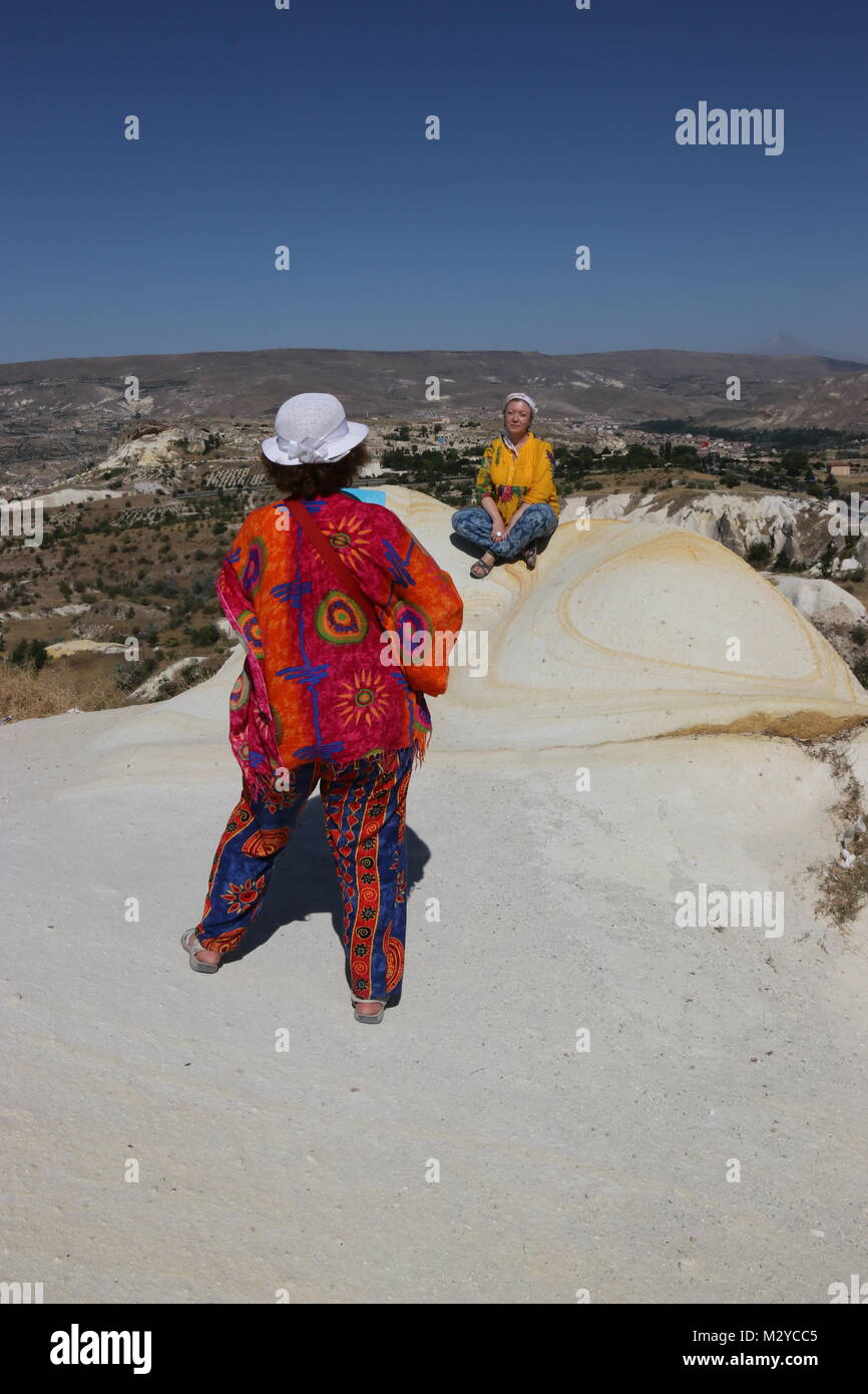 Tourists visiting some of the famous Fairy chimneys in Cappadocia which ...