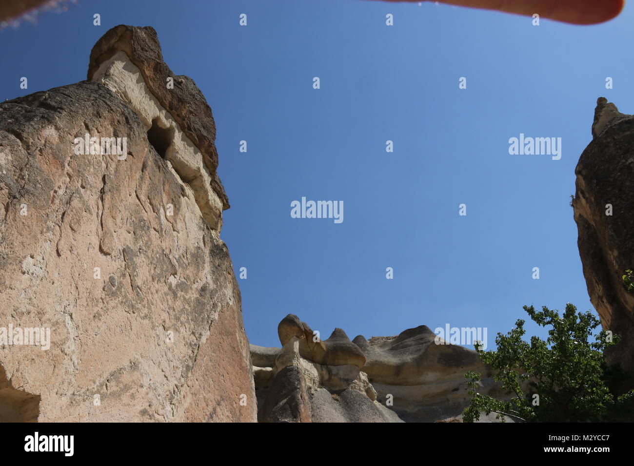 Tourists visiting some of the famous Fairy chimneys in Cappadocia which ...