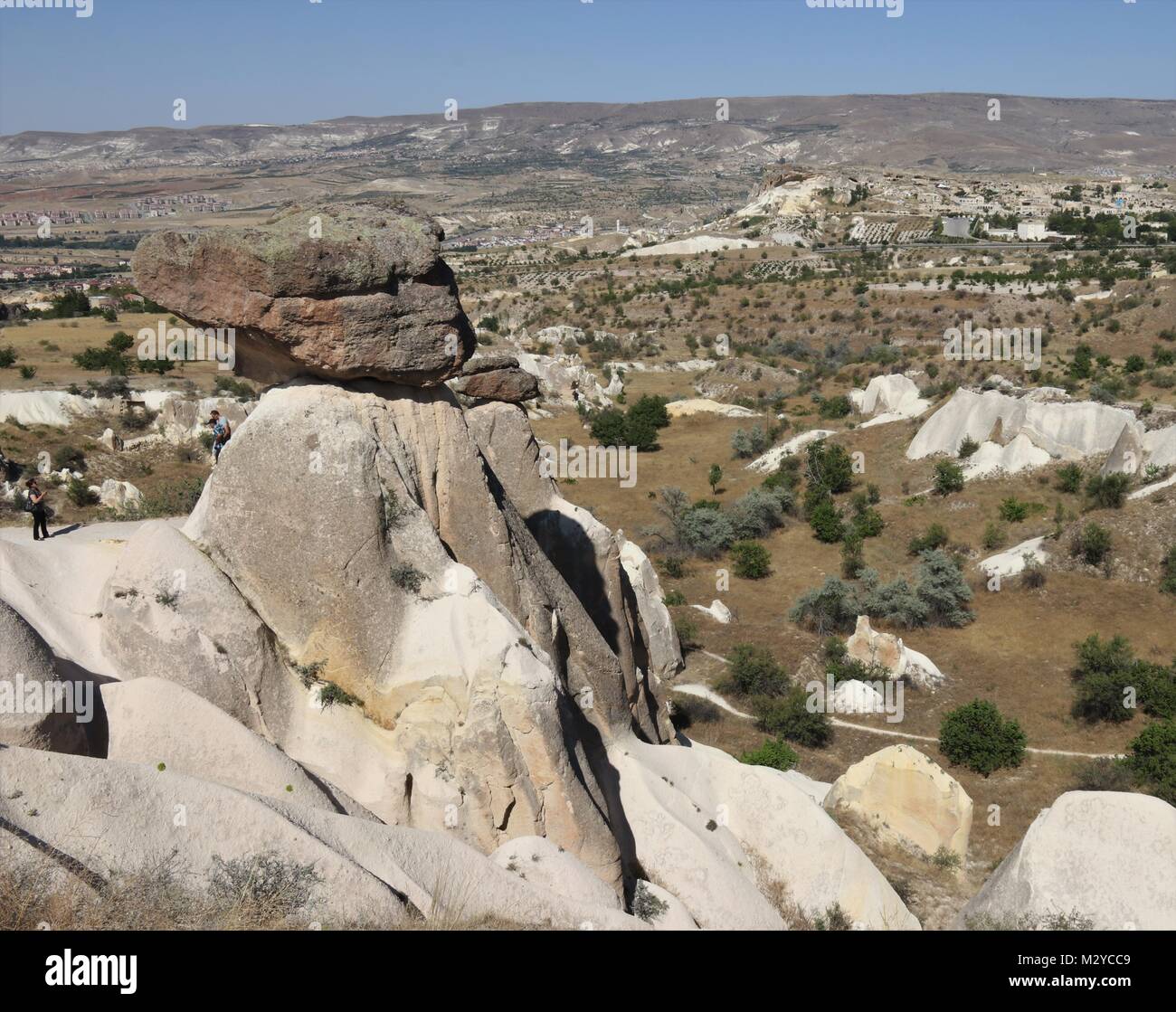 Tourists visiting some of the famous Fairy chimneys in Cappadocia which ...