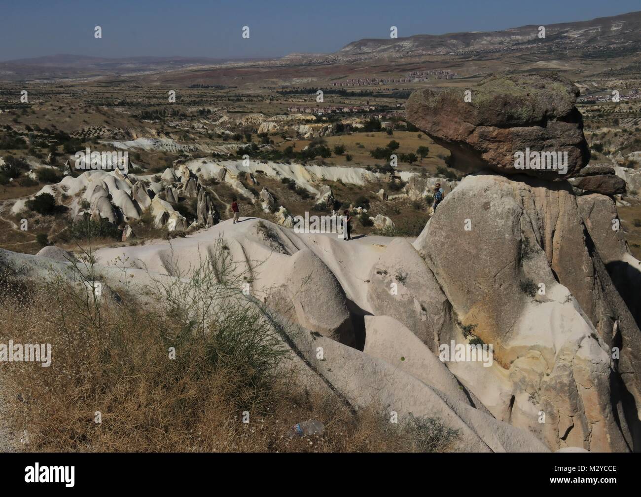 Tourists visiting some of the famous Fairy chimneys in Cappadocia which ...