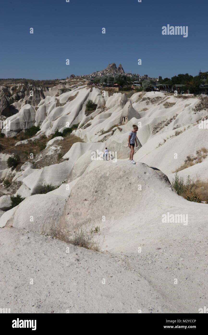 Tourists visiting some of the famous Fairy chimneys in Cappadocia which ...