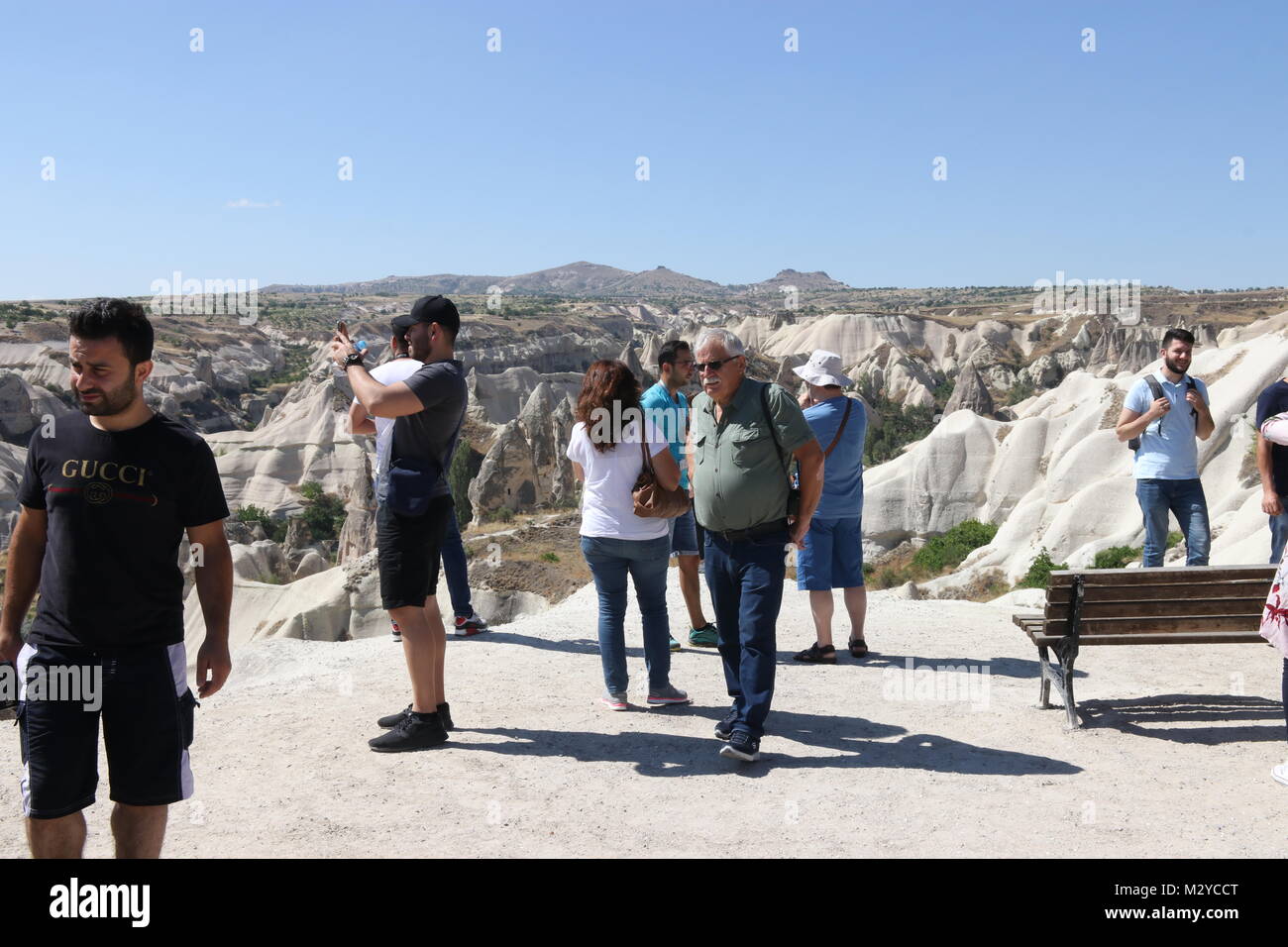 Tourists visiting some of the famous Fairy chimneys in Cappadocia which ...