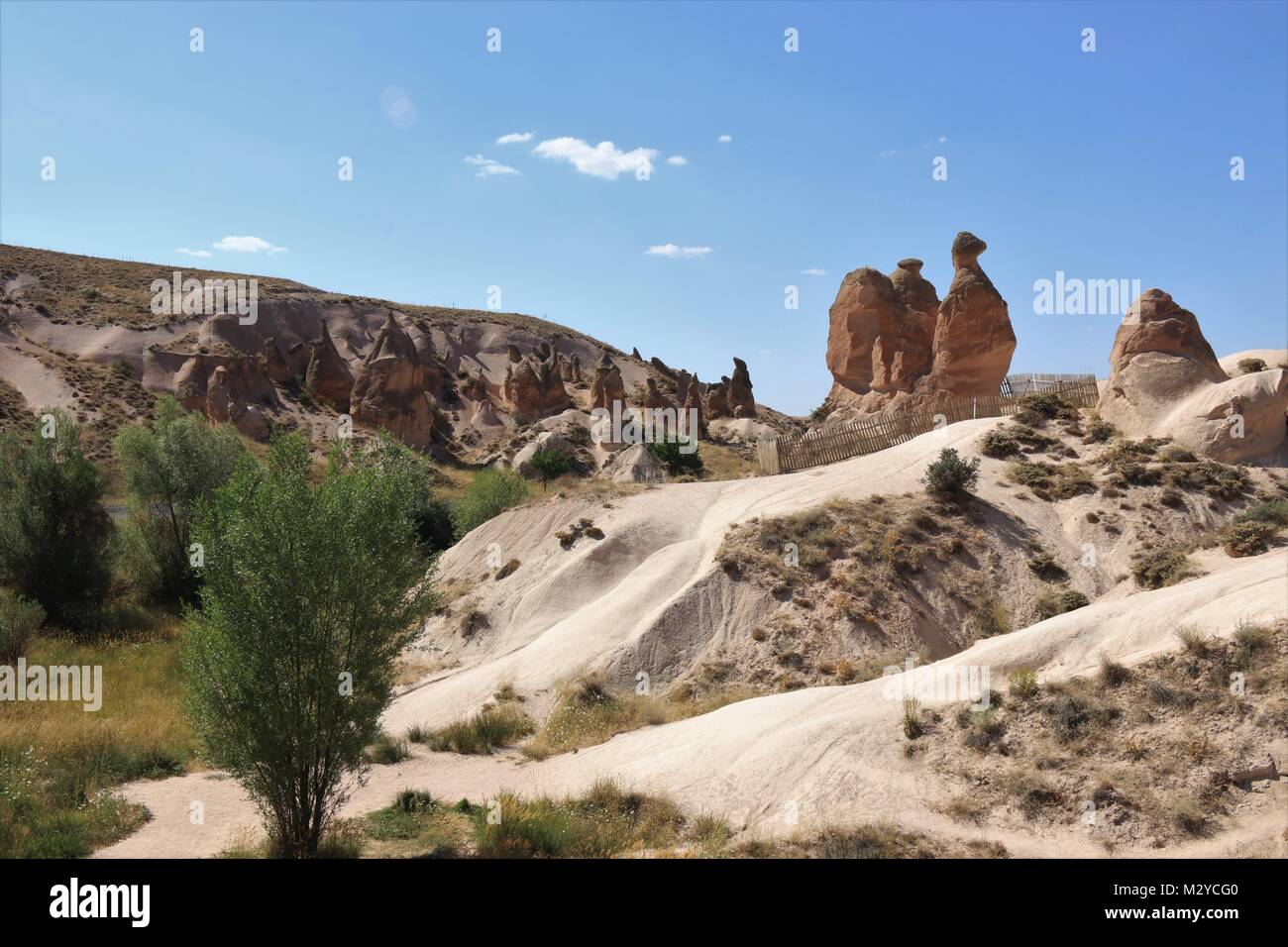 Tourists visiting some of the famous Fairy chimneys in Cappadocia which ...