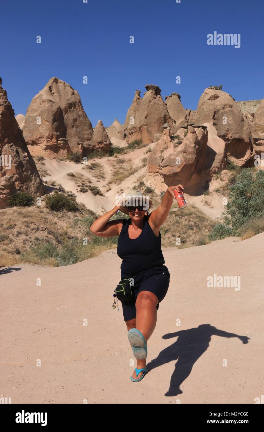 Tourists visiting some of the famous Fairy chimneys in Cappadocia which ...