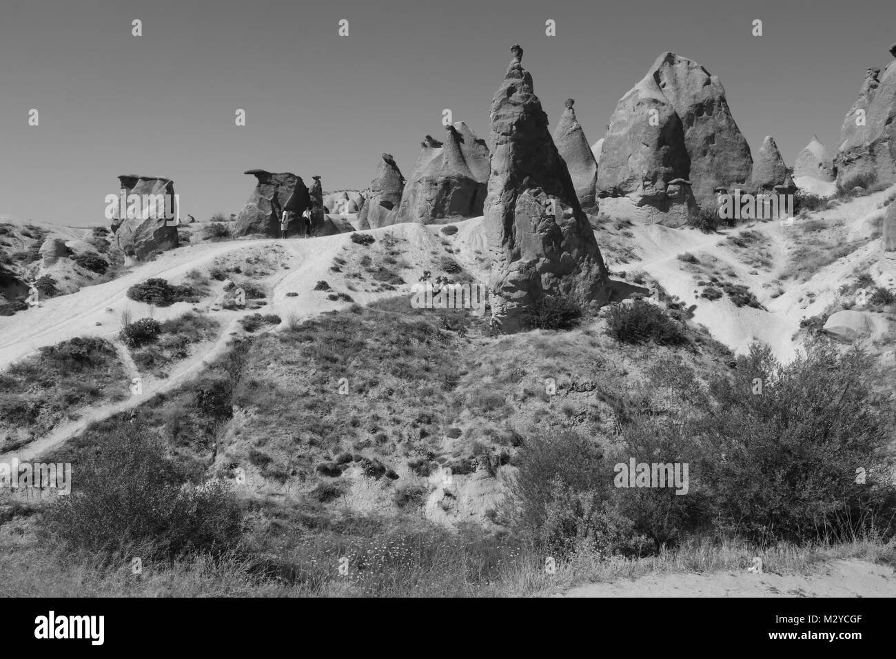 Tourists visiting some of the famous Fairy chimneys in Cappadocia which ...