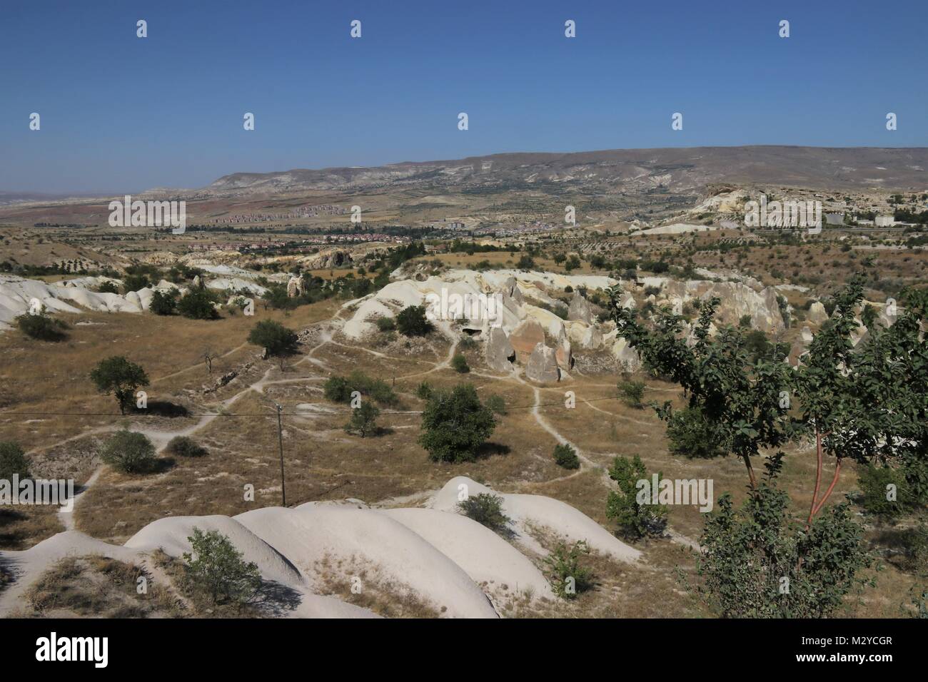 Tourists visiting some of the famous Fairy chimneys in Cappadocia which ...