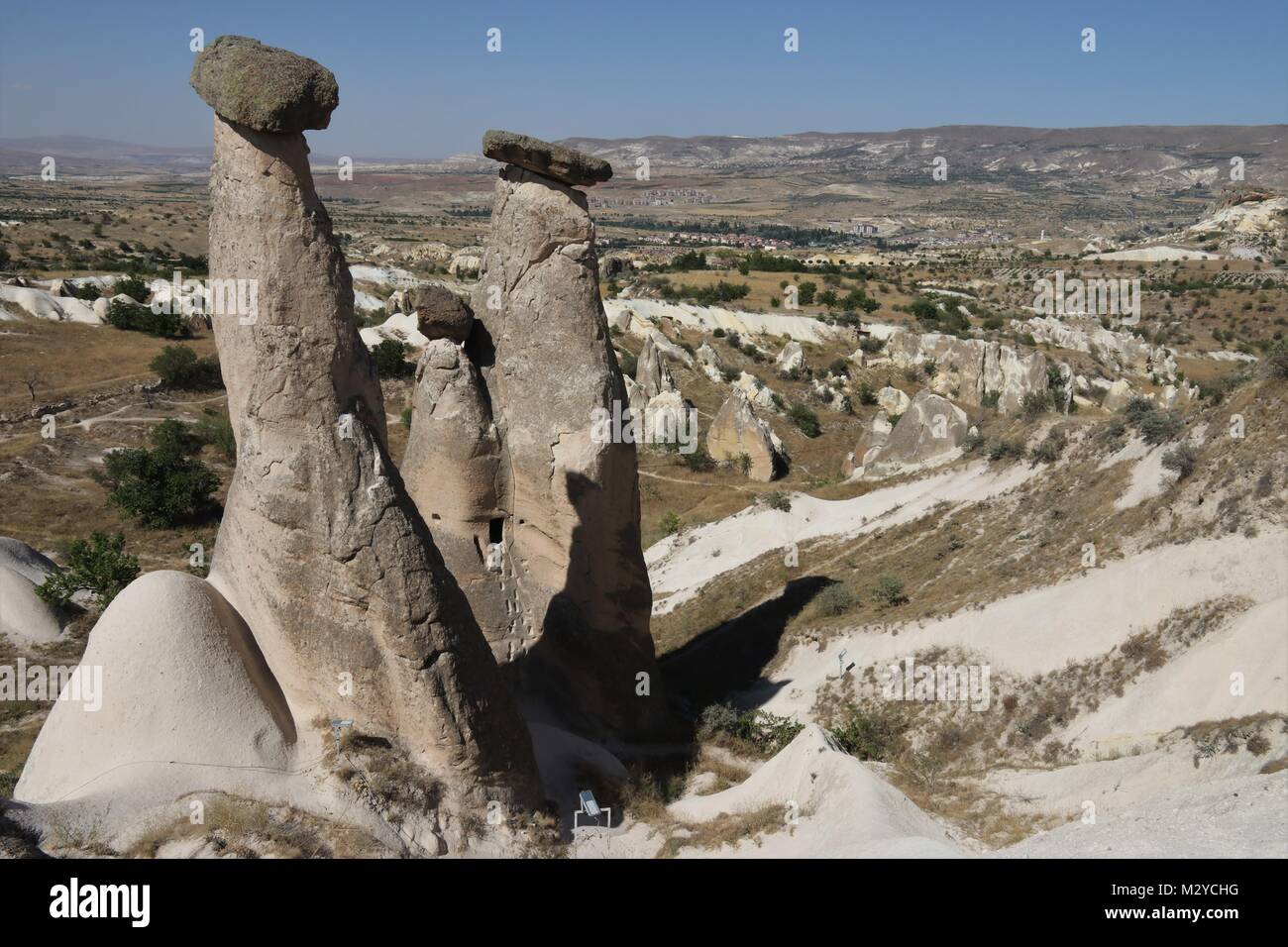 Tourists visiting some of the famous Fairy chimneys in Cappadocia which ...