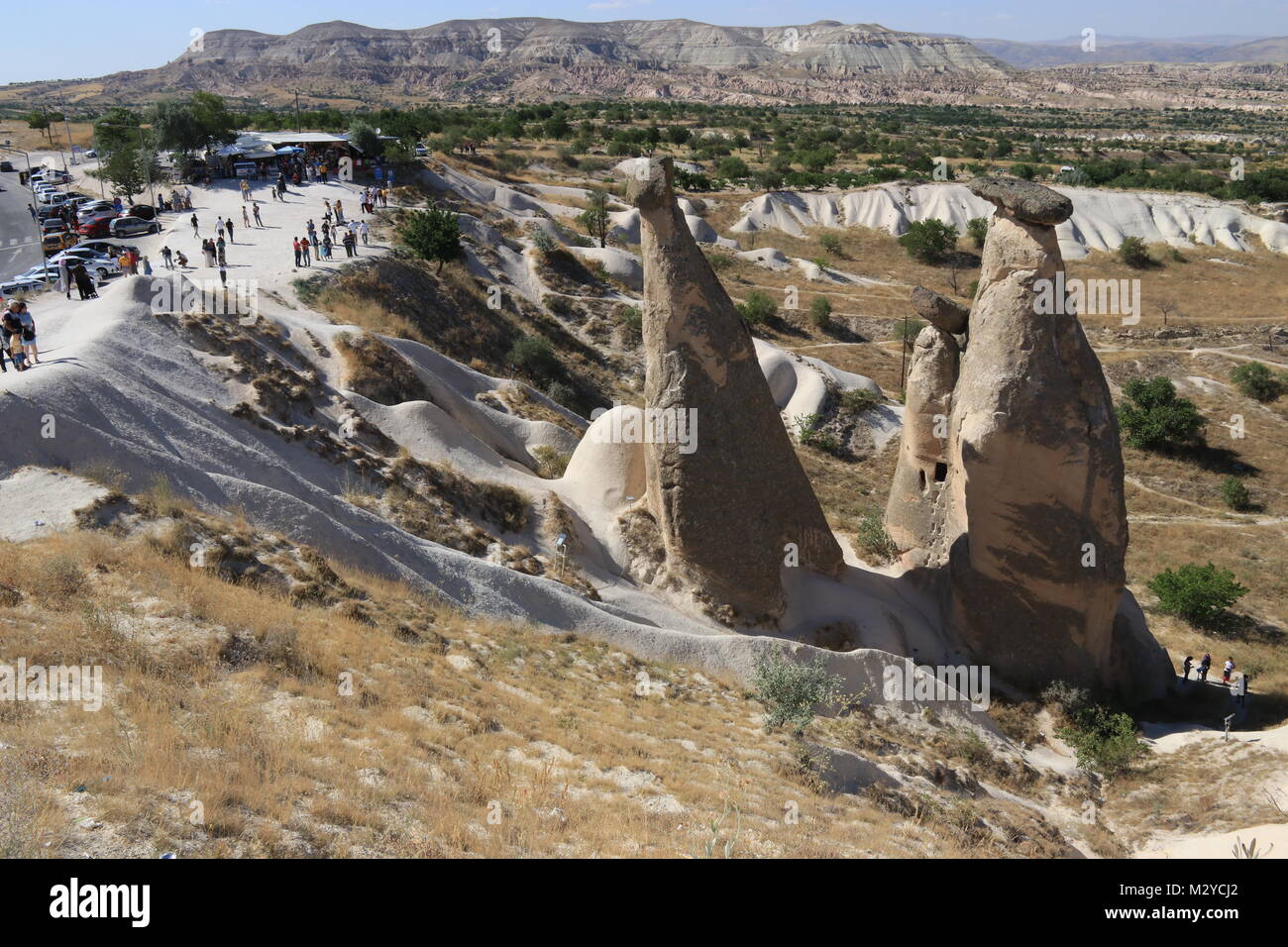 Tourists visiting some of the famous Fairy chimneys in Cappadocia which ...