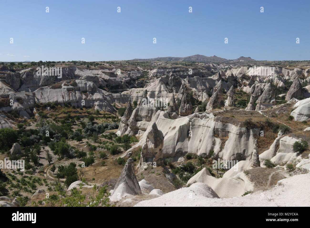 Tourists visiting some of the famous Fairy chimneys in Cappadocia which ...