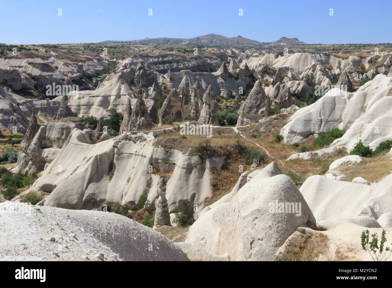 Tourists visiting some of the famous Fairy chimneys in Cappadocia which ...