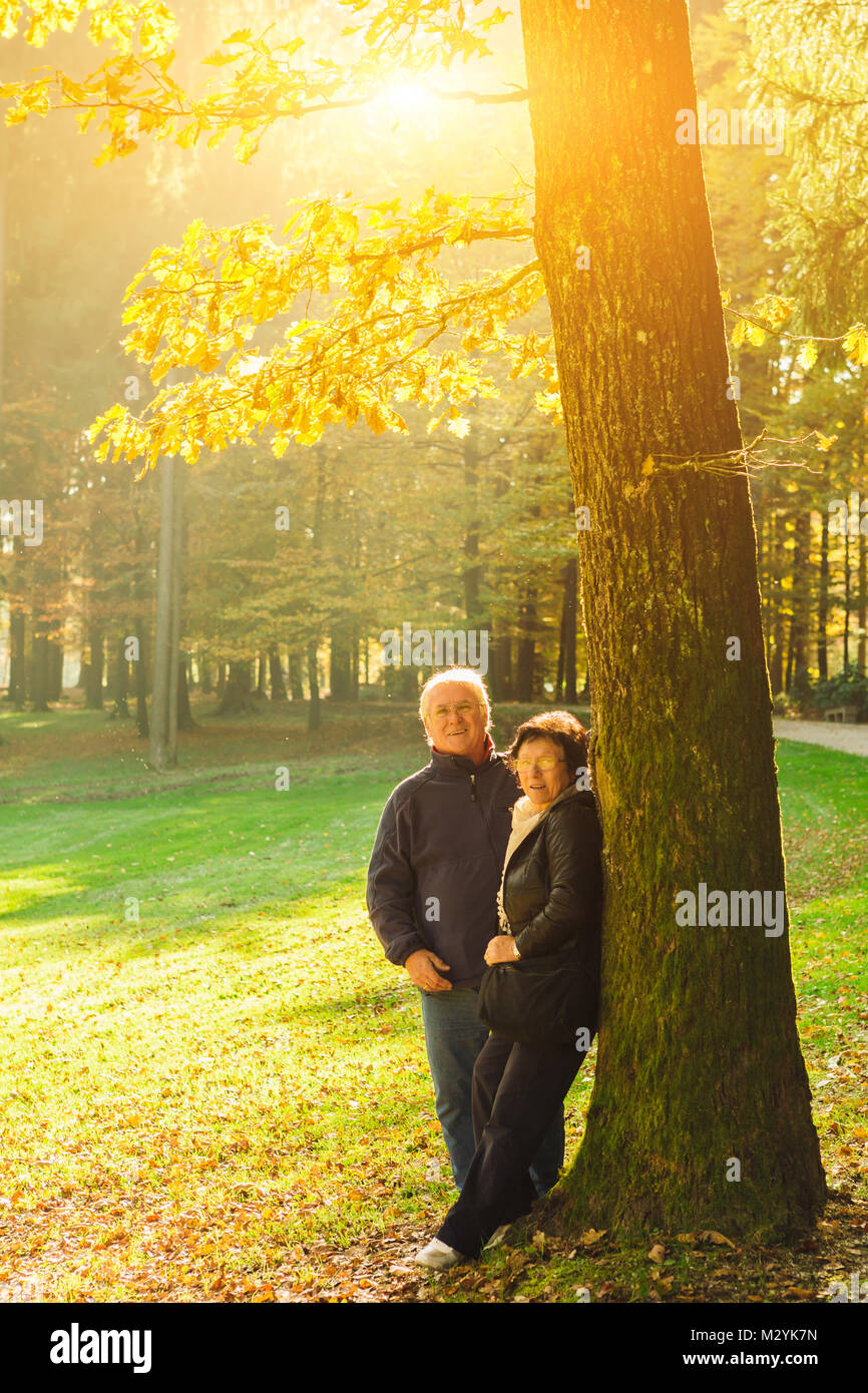Senior couple enjoying time at the park at the sunset. Concerpt Family ...