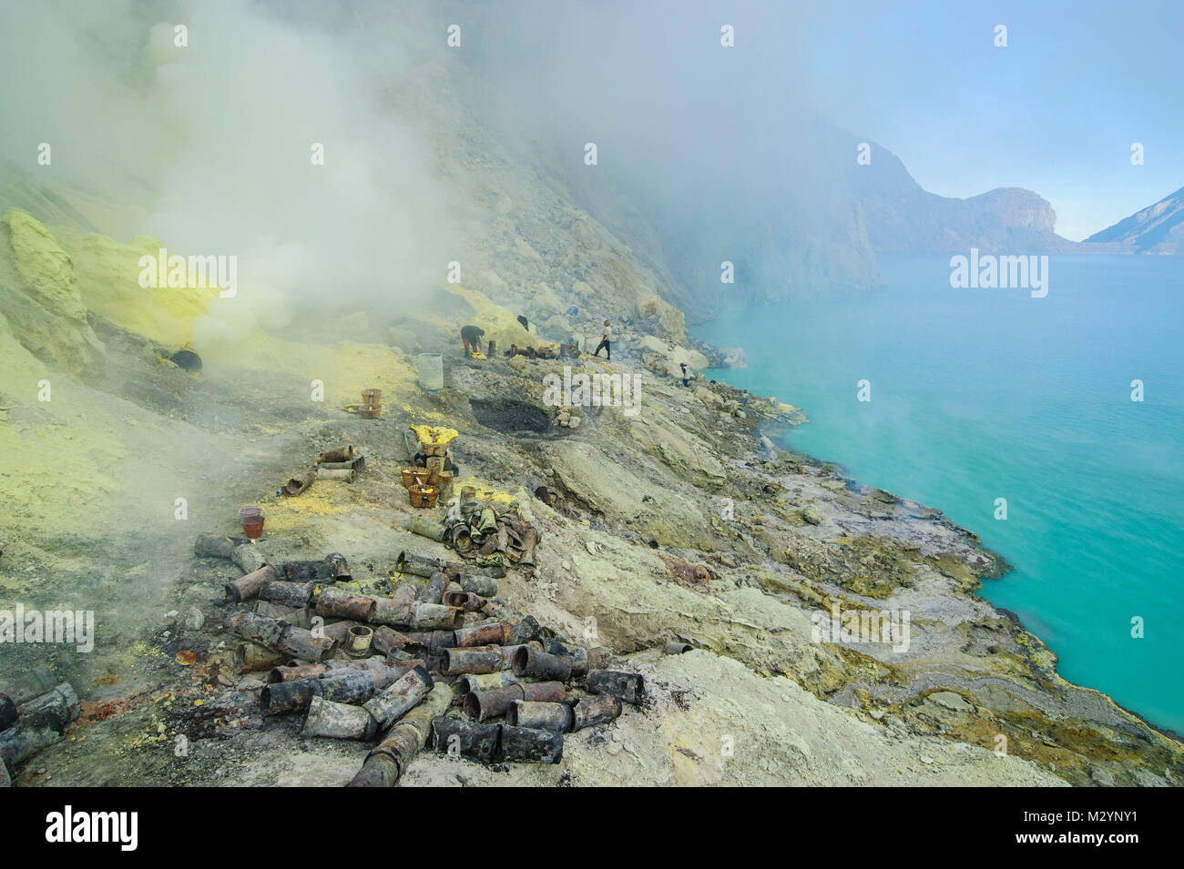 Sulphur mine in the steaming sulphur vapor, Ijen Volcano, Java ...