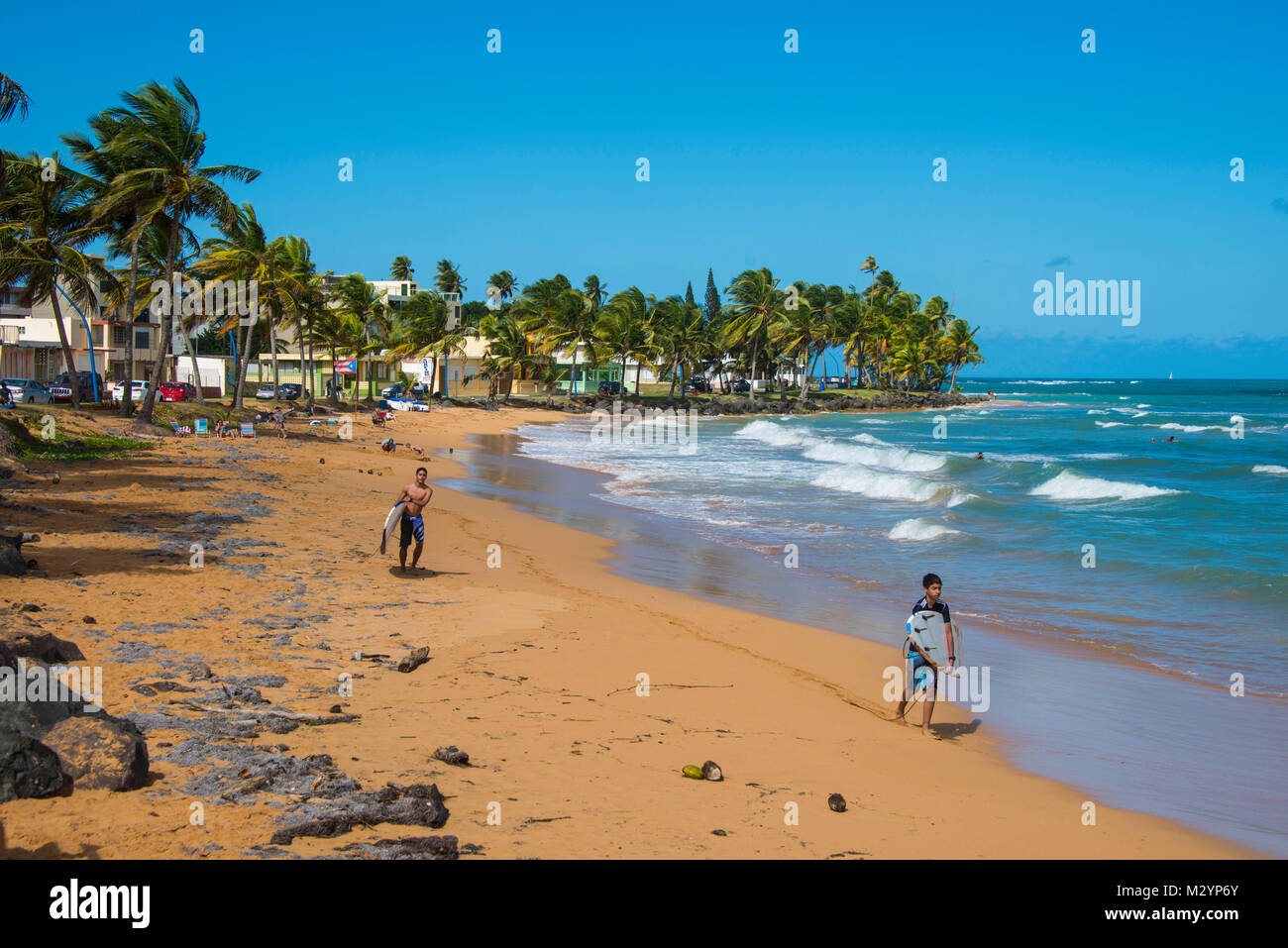 Surfer on Luquillo beach Puerto Rico, Caribbean Stock Photo - Alamy