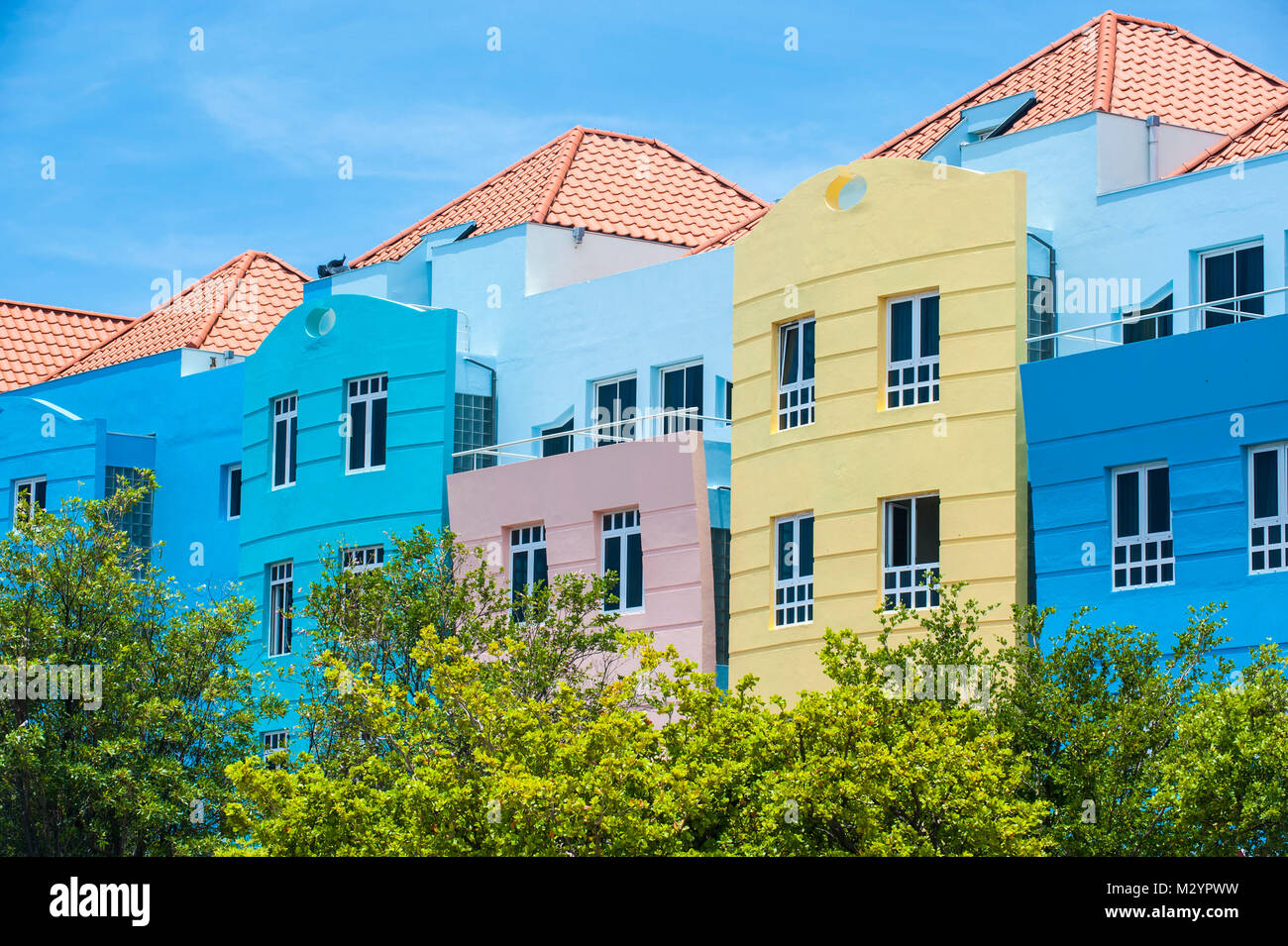 The colourful dutch houses at the Sint Annabaai in Wilemstad City ...