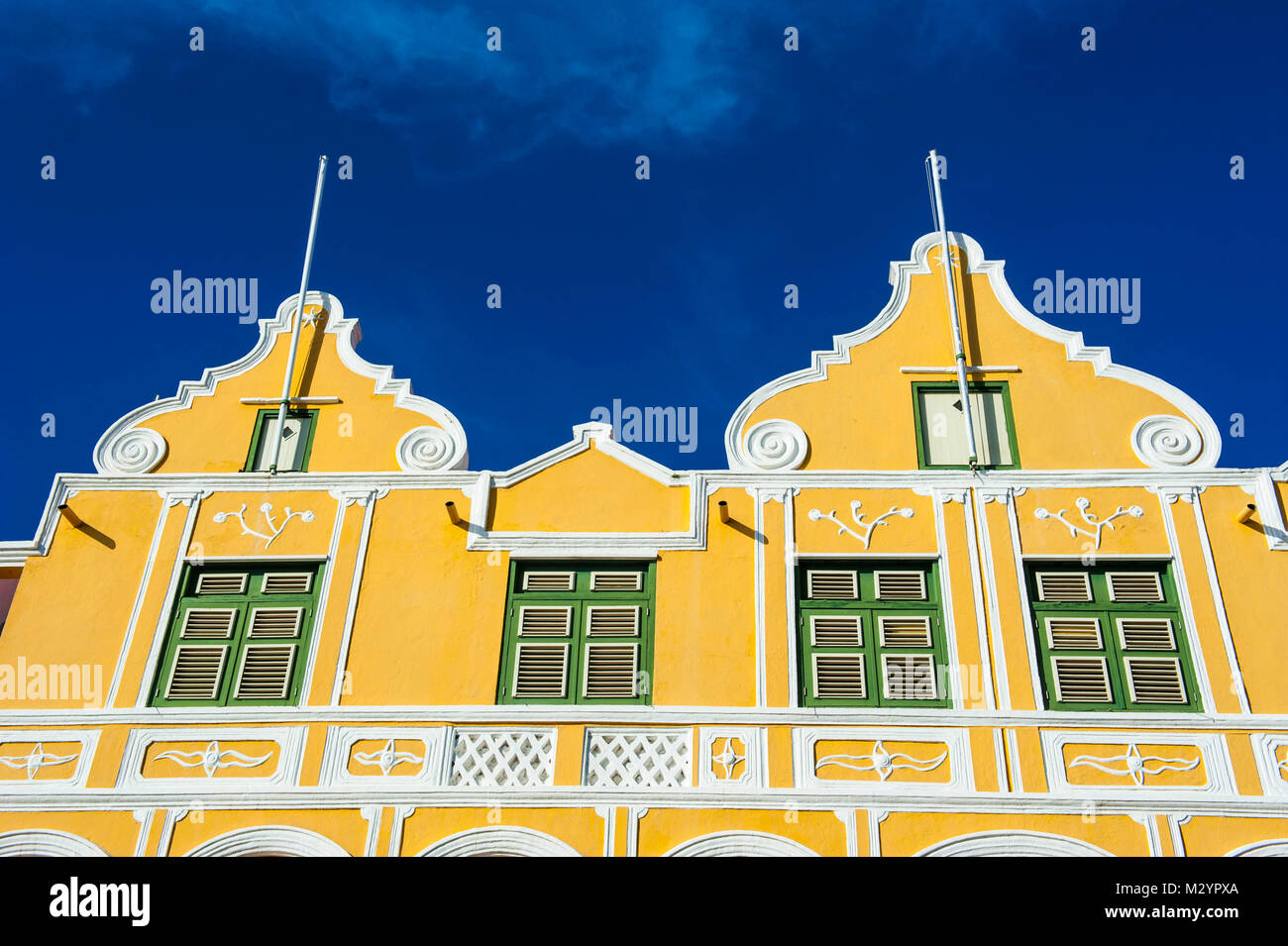 The colourful dutch houses at the Sint Annabaai in Wilemstad City ...
