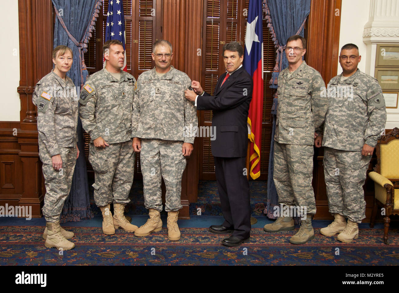 Texas Governor Rick Perry presents the badges to the Governor's Twenty ...