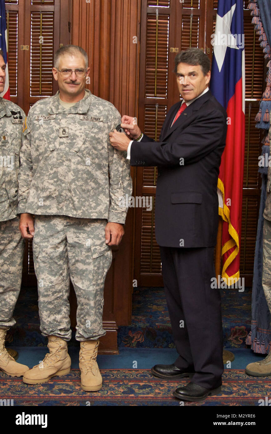 Texas Governor Rick Perry presents the badges to the Governor's Twenty ...