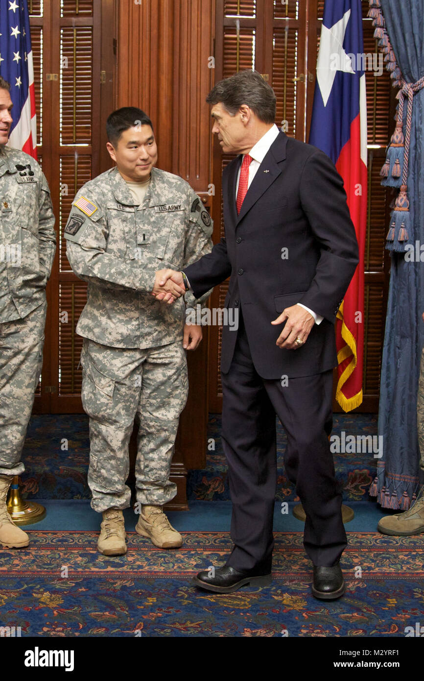 Texas Governor Rick Perry presents the badges to the Governor's Twenty ...
