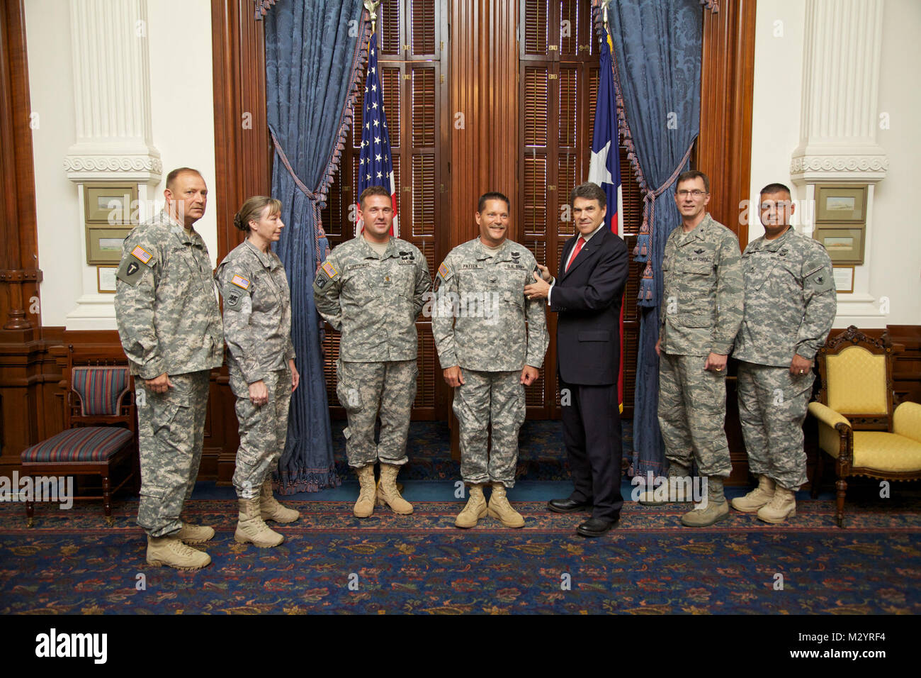 Texas Governor Rick Perry presents the badges to the Governor's Twenty ...