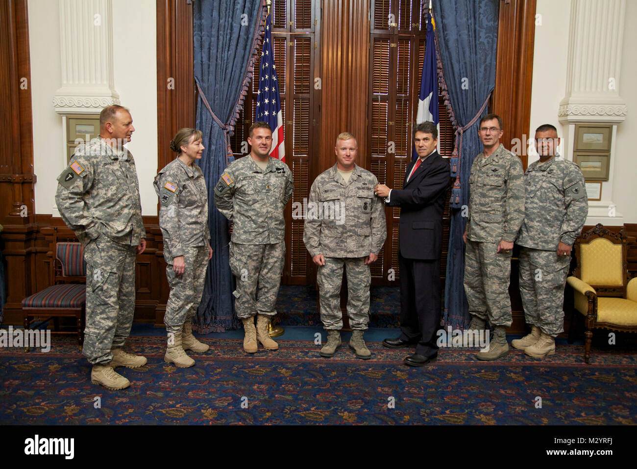 Texas Governor Rick Perry presents the badges to the Governor's Twenty ...