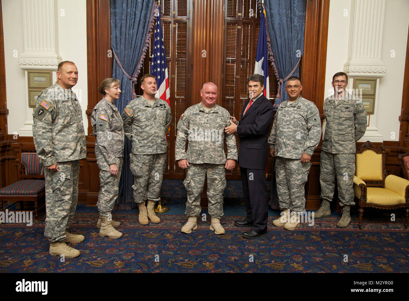 Texas Governor Rick Perry presents the badges to the Governor's Twenty ...