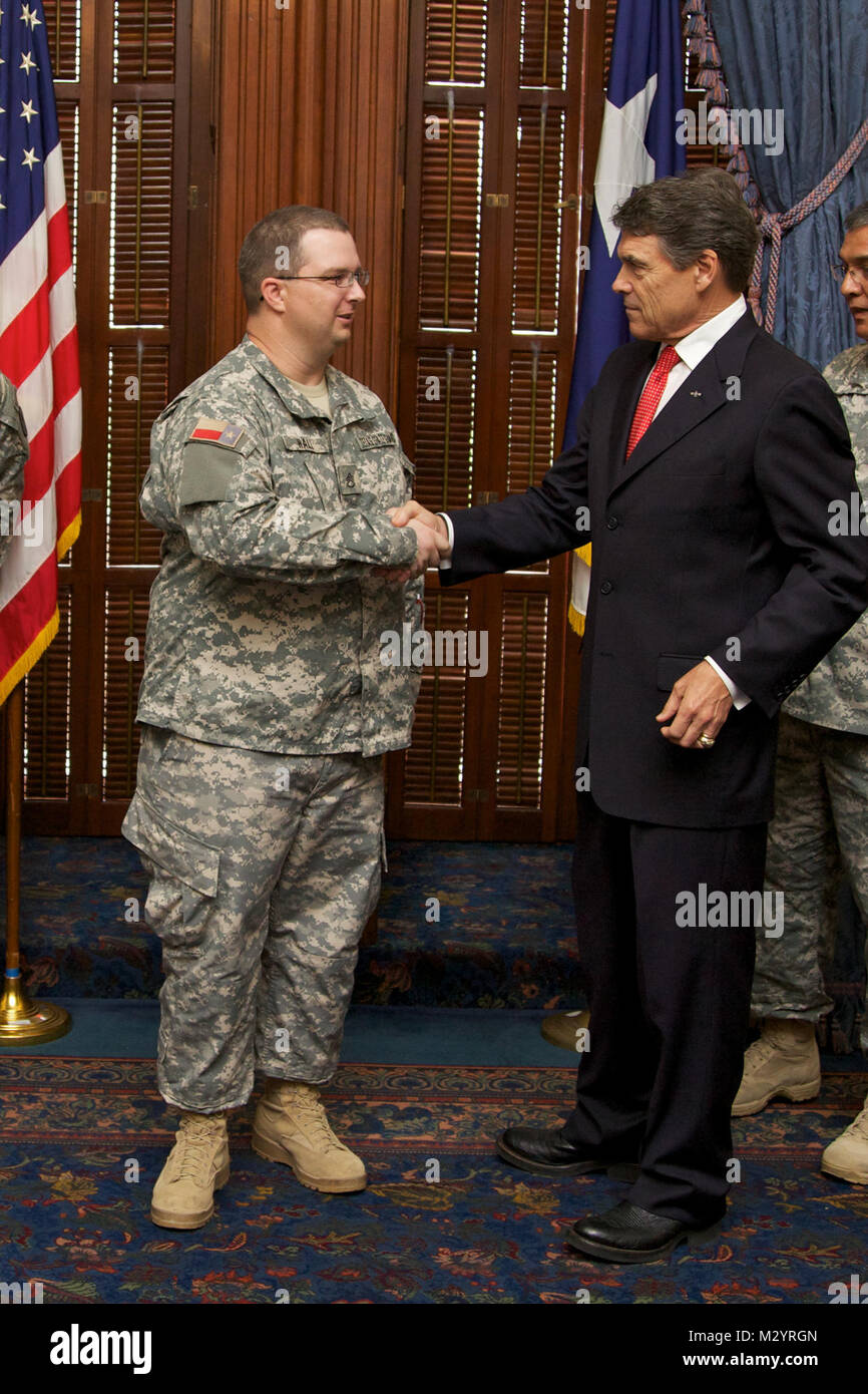 Texas Governor Rick Perry presents the badges to the Governor's Twenty ...