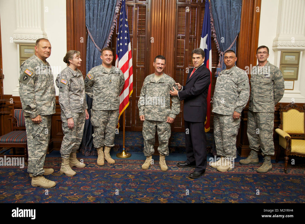 Texas Governor Rick Perry presents the badges to the Governor's Twenty ...