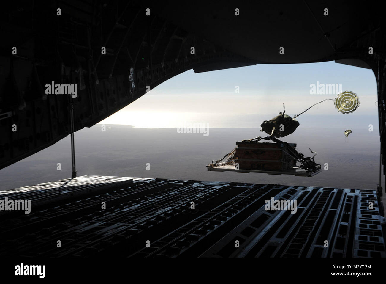 A pallet flies off the ramp of a U.S. Air Force C-17 Globemaster III ...