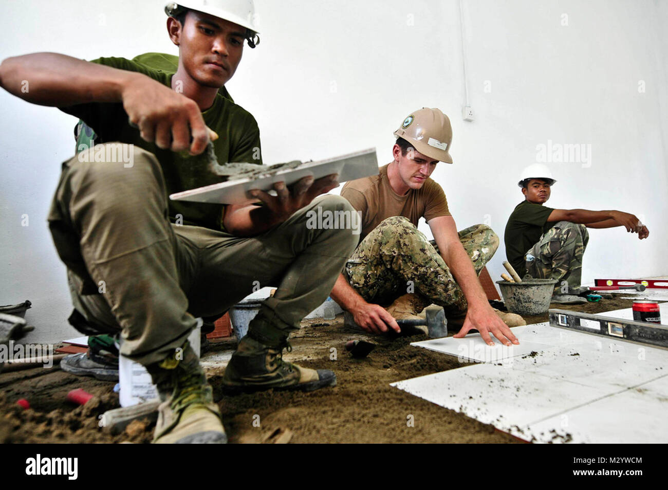 Lays floor tile with members from the Cambodian Army by #PACOM Stock ...