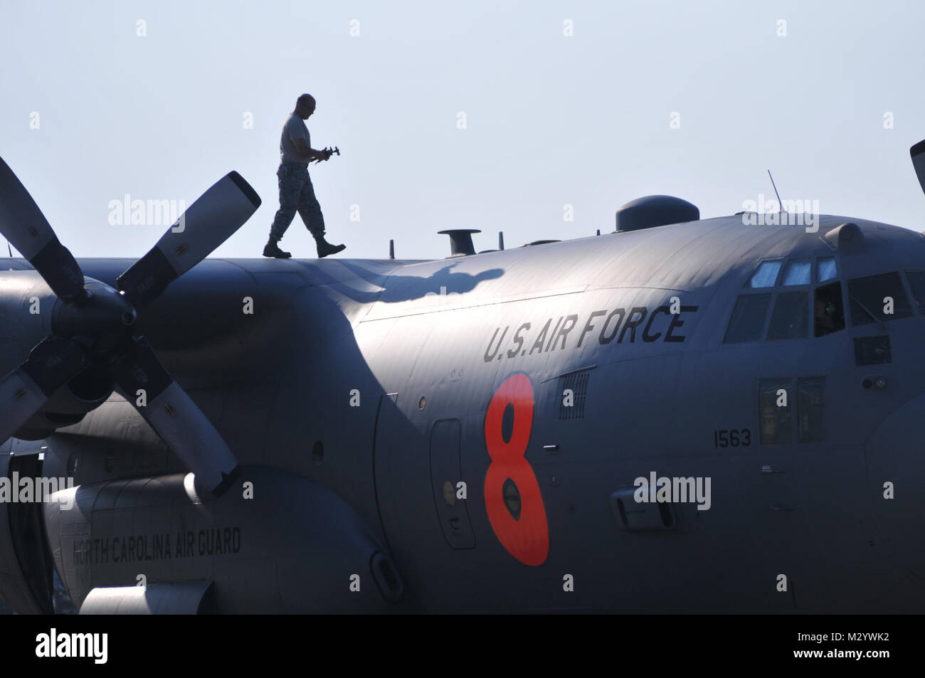 Master Sgt. Rodney Hall walks the wing of MAFFS 8, during a pre-flight ...