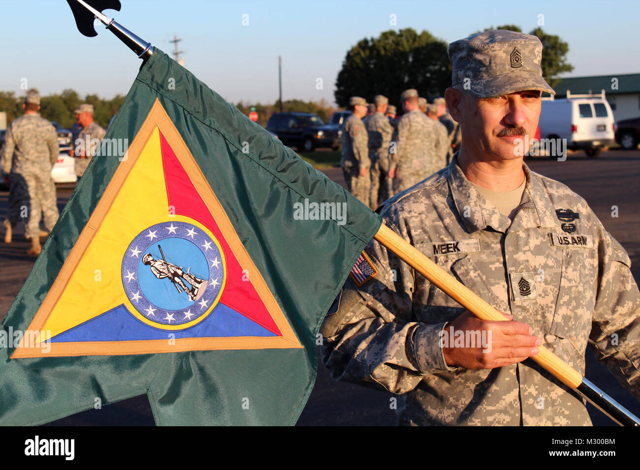 Command Sgt. Maj. Meek presents the new colors for Camp Gruber after ...