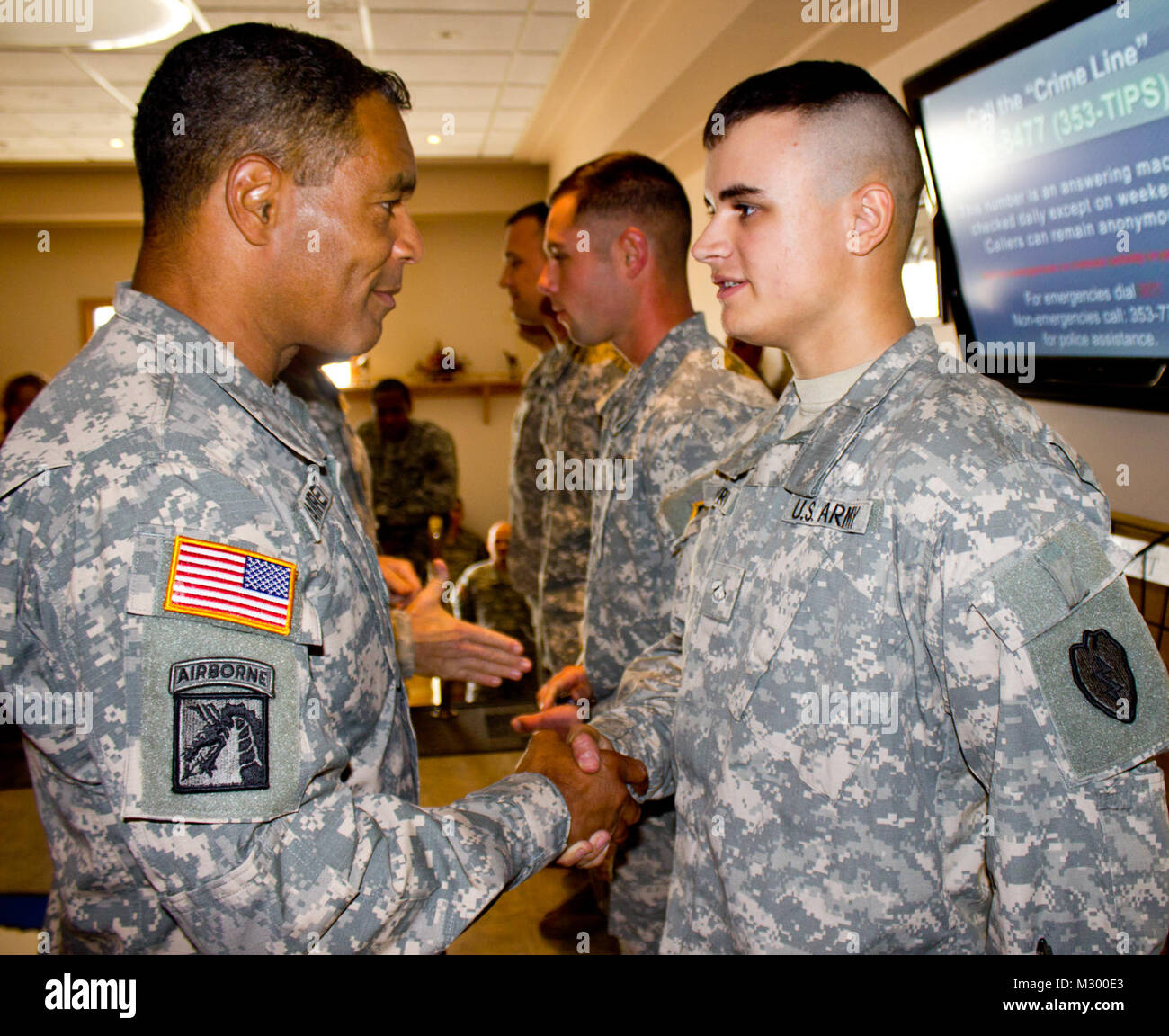 Maj. Gen. Michael Garrett, commander of U.S. Army Alaska, presents a ...