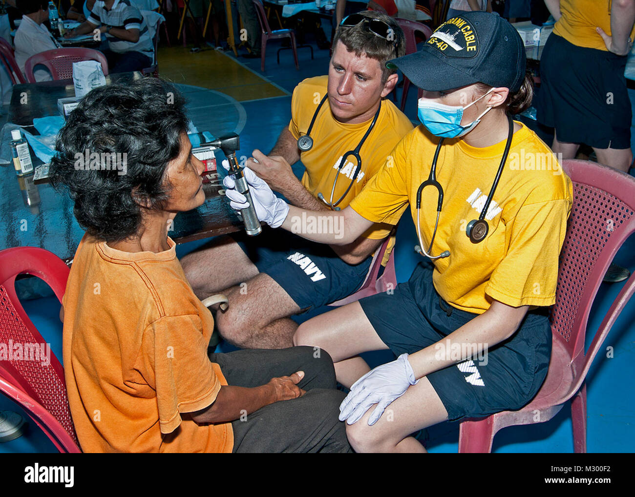PI Perform eye exam during community serice event by #PACOM Stock Photo ...