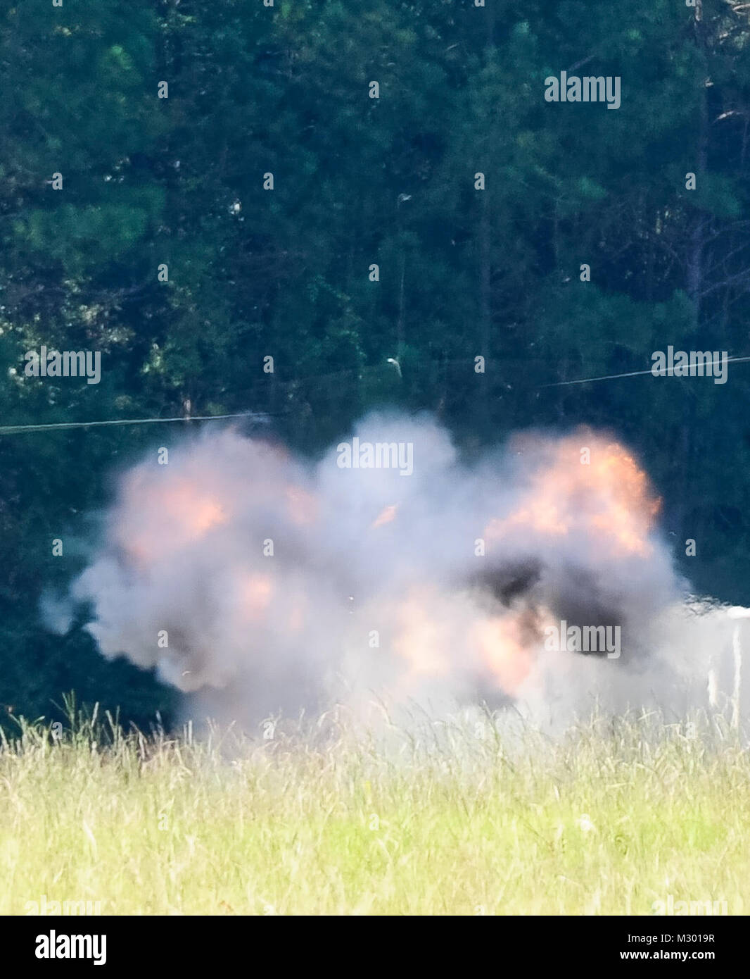 Explosive charges detonate during an explosive ordnance disposal (EOD ...