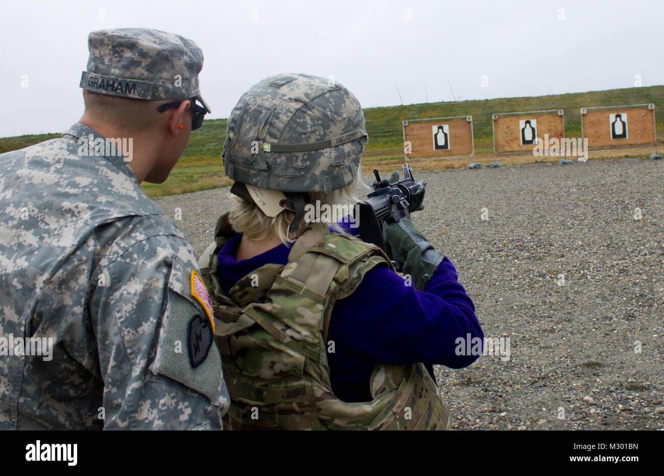 Army Wife, Shelby Graham fires the M4 Carbine while her husband Spc ...