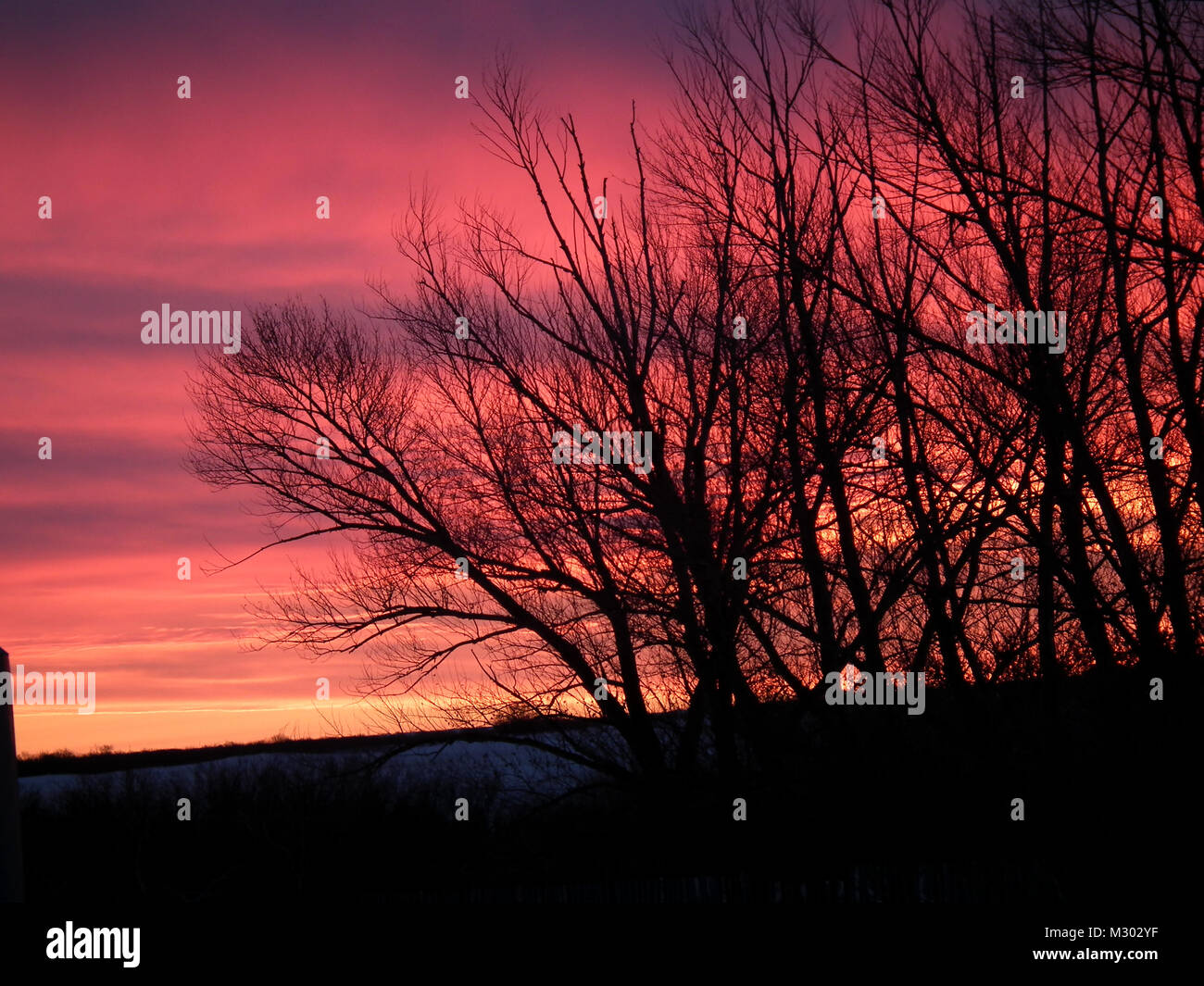 Fiery red winter sky in Saskatchewan Stock Photo - Alamy