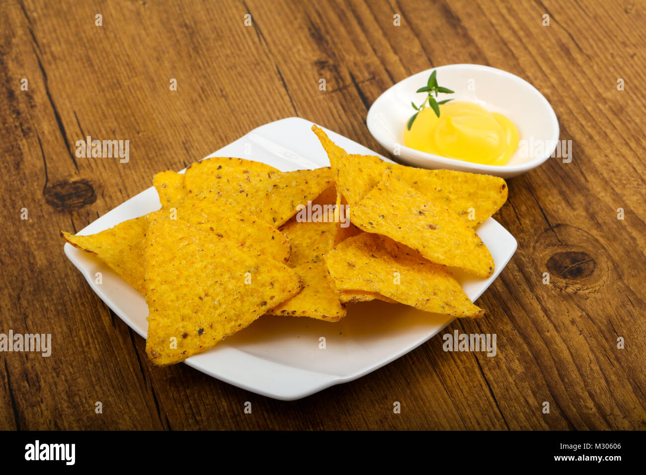 Nachos with cheese sauce Stock Photo - Alamy