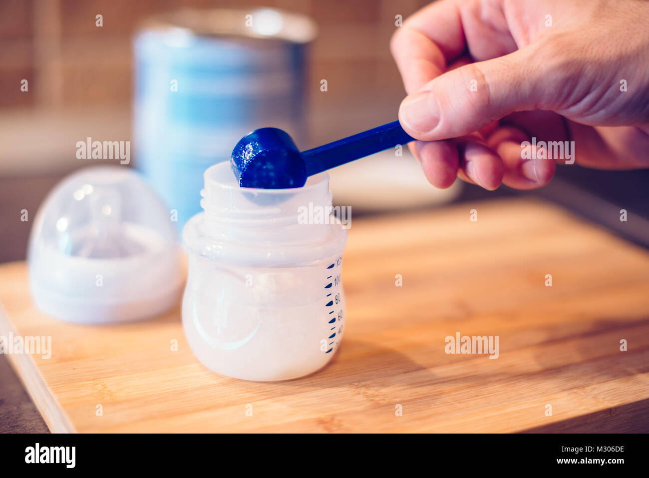 Father making baby formula in milk bottle for a newborn baby feed Stock ...