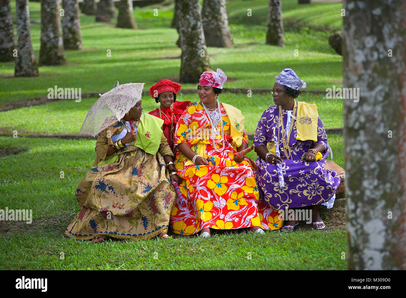 Suriname, Paramaribo. Creole women in Kotomisi dress, the national ...