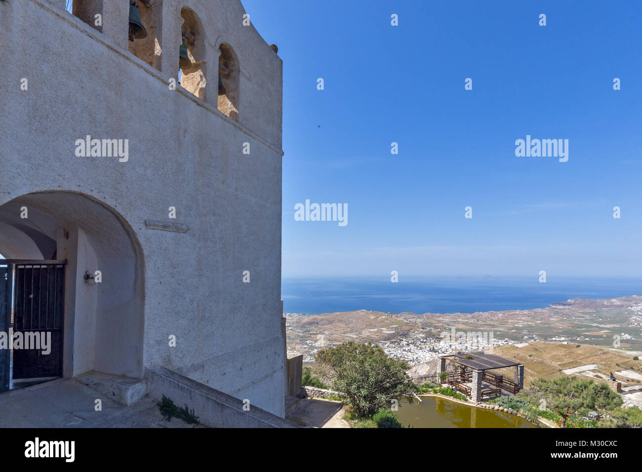 Entrance of Monastery Prophet Elias and panorama to Santorini island ...