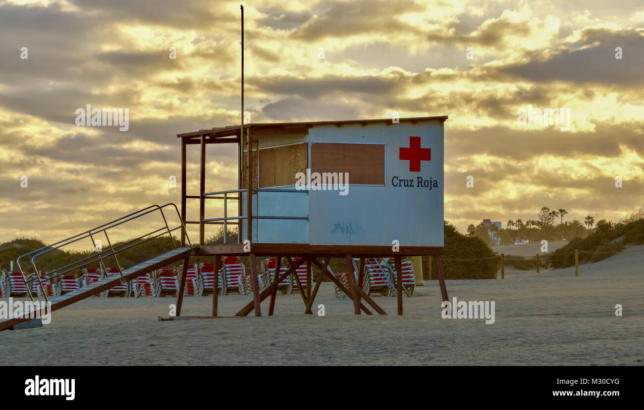First aid hut on beach at sunset Stock Photo - Alamy
