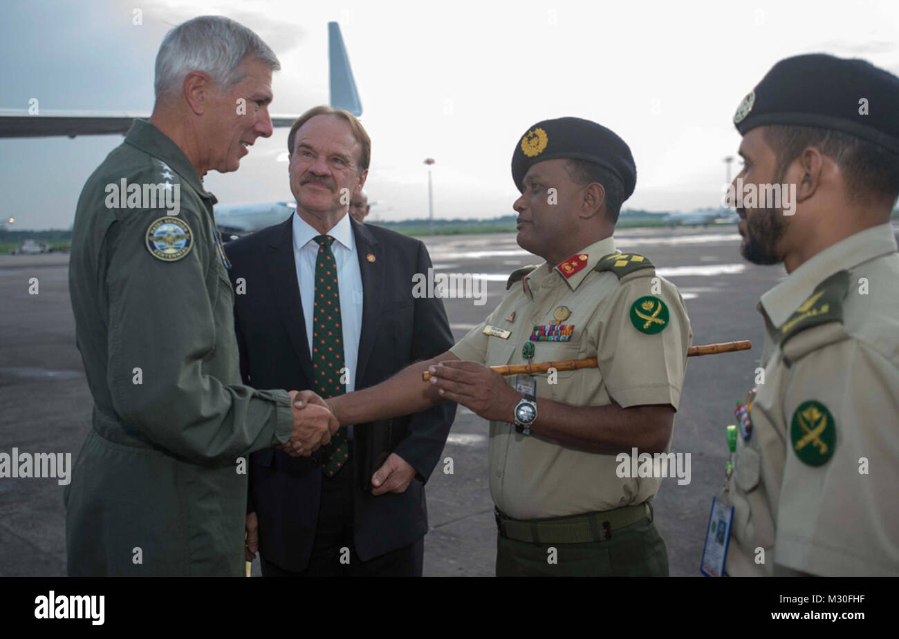 Adm. Samuel J Locklear III (left) is greeted by U.S. Ambassador to ...