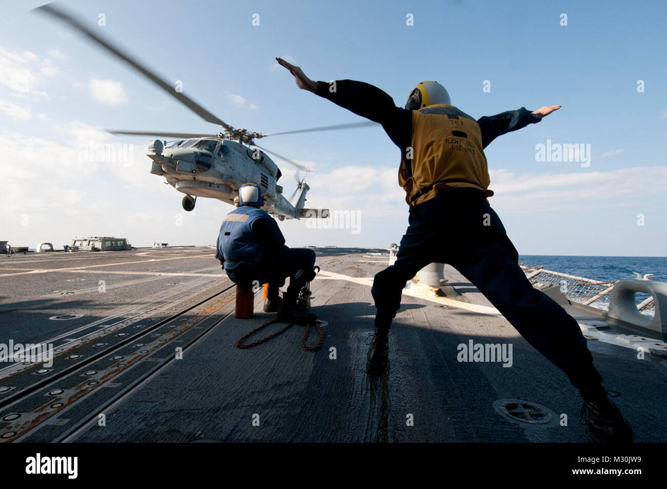Sailors conduct flight operations at sea with the Warlords of ...