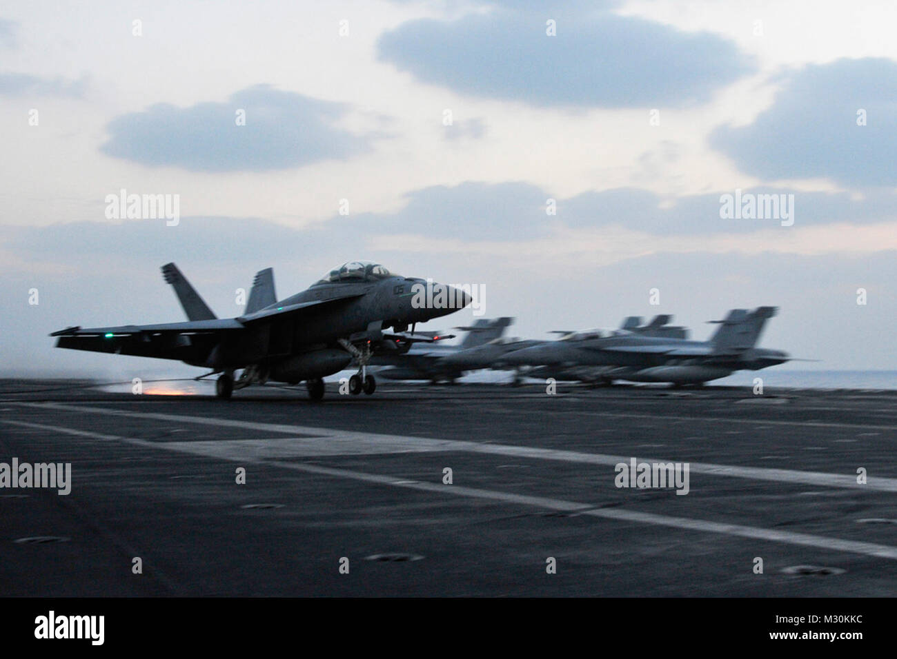 Landing aboard the U.S. Navy's forward-deployed aircraft carrier USS ...