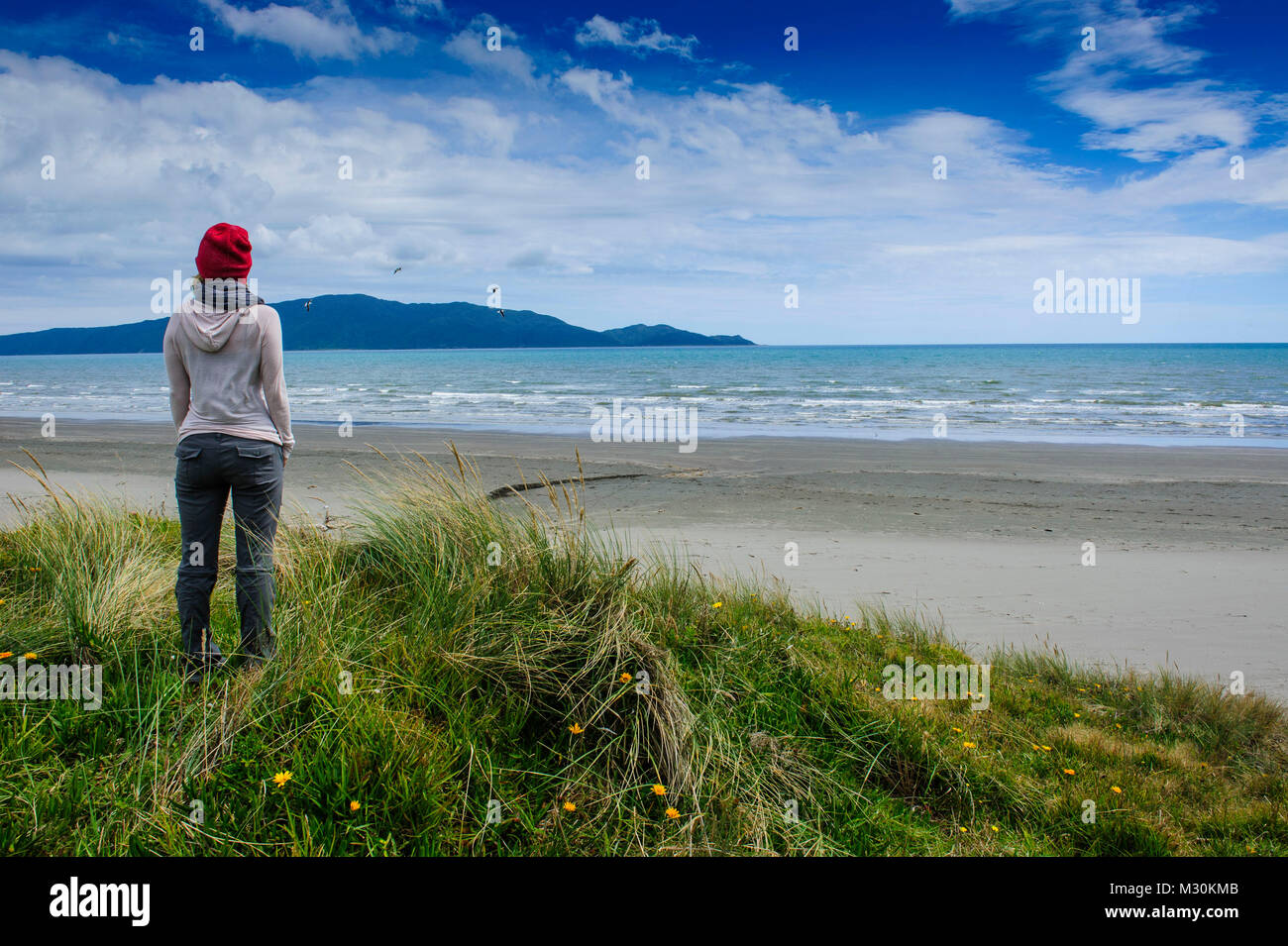 Woman enjoying the view over Foxton beach, Kapiti Coast, North island ...
